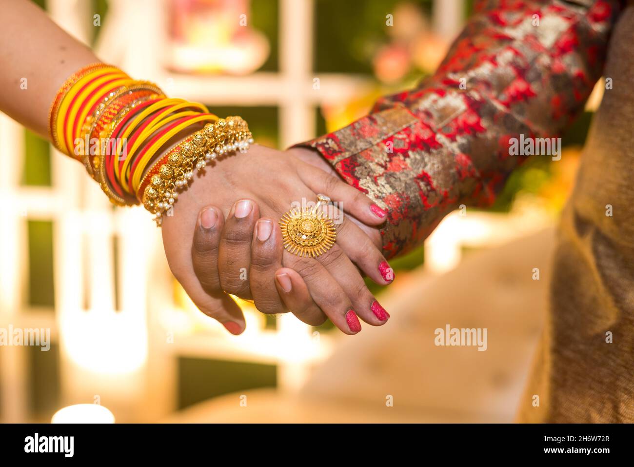 Indian Wedding Couple Holding Hands