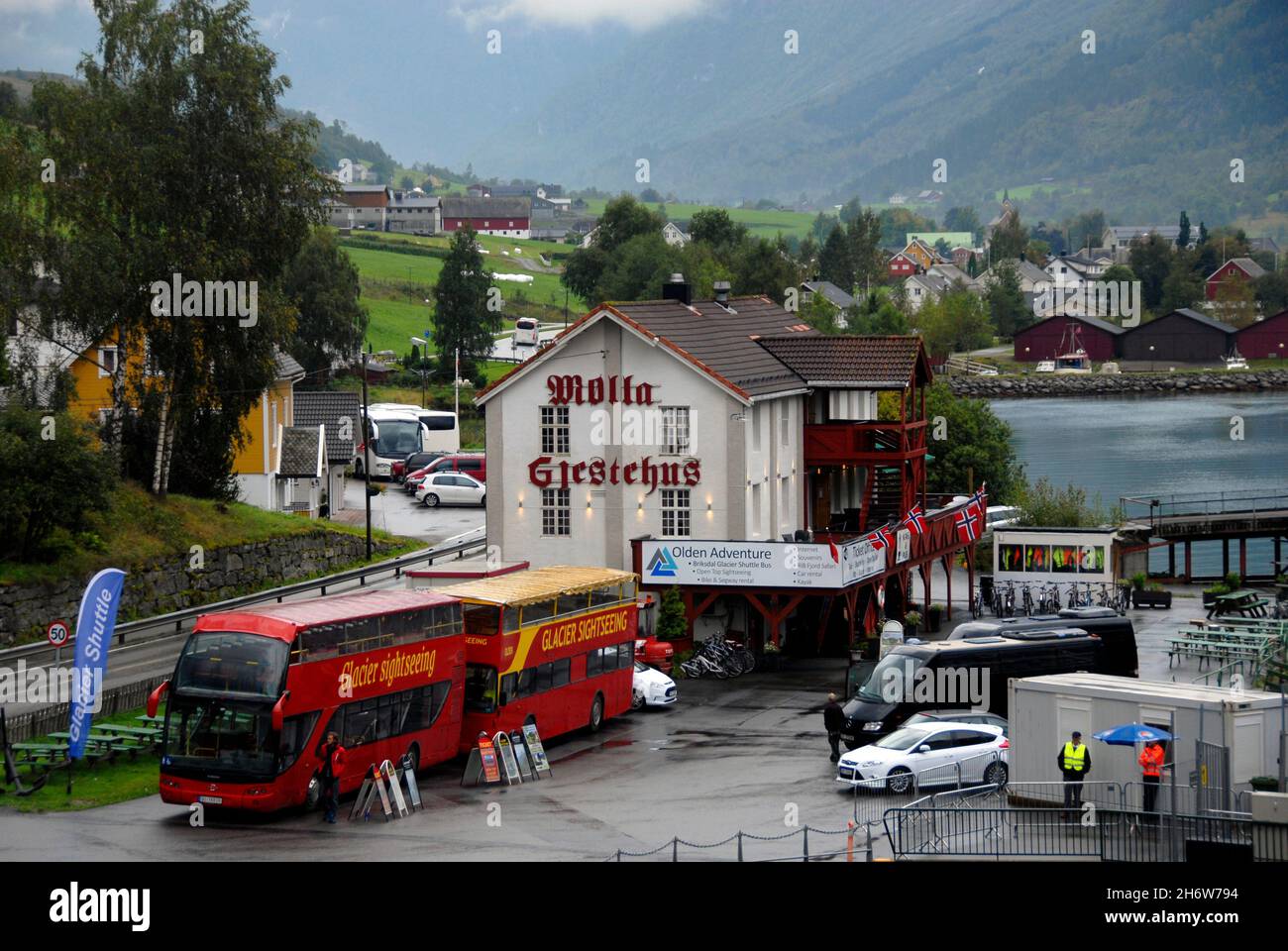 The port of Olden, Norway with transport waiting to take cruise ship ...