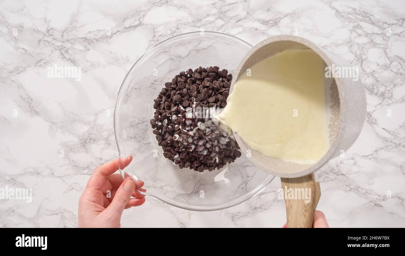 Preparing chocolate ganache in glass hi-res stock photography and ...