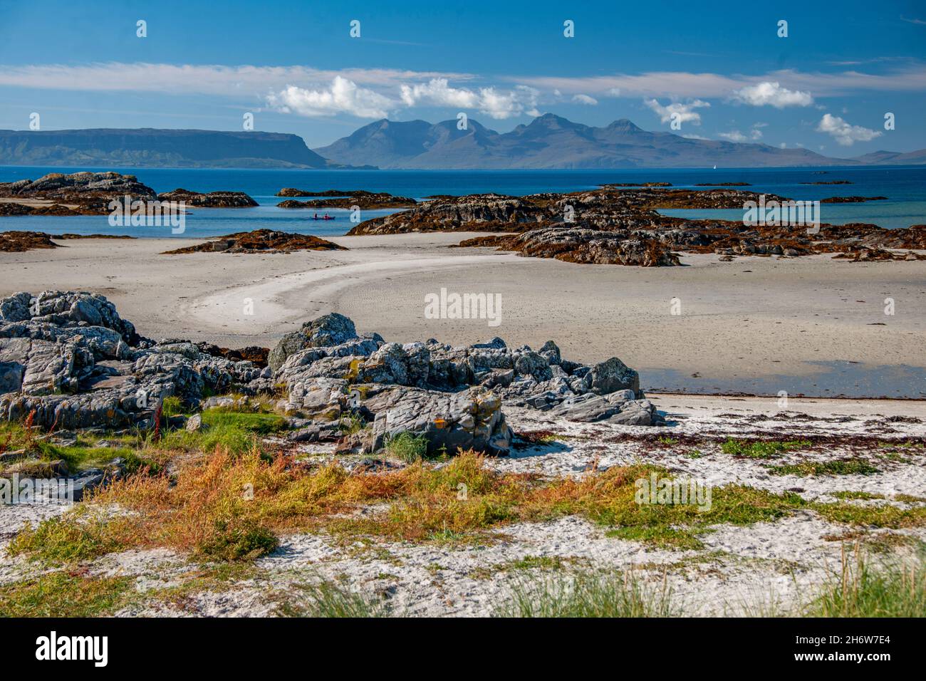 Summer view across the sands towards Eigg & Rum from Morar, west ...