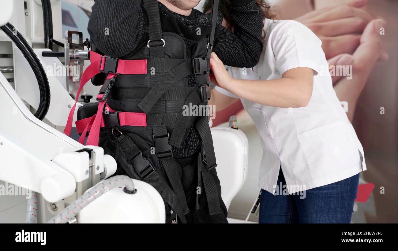 close-up of a doctor performing a rehabilitation of a child patient in ...