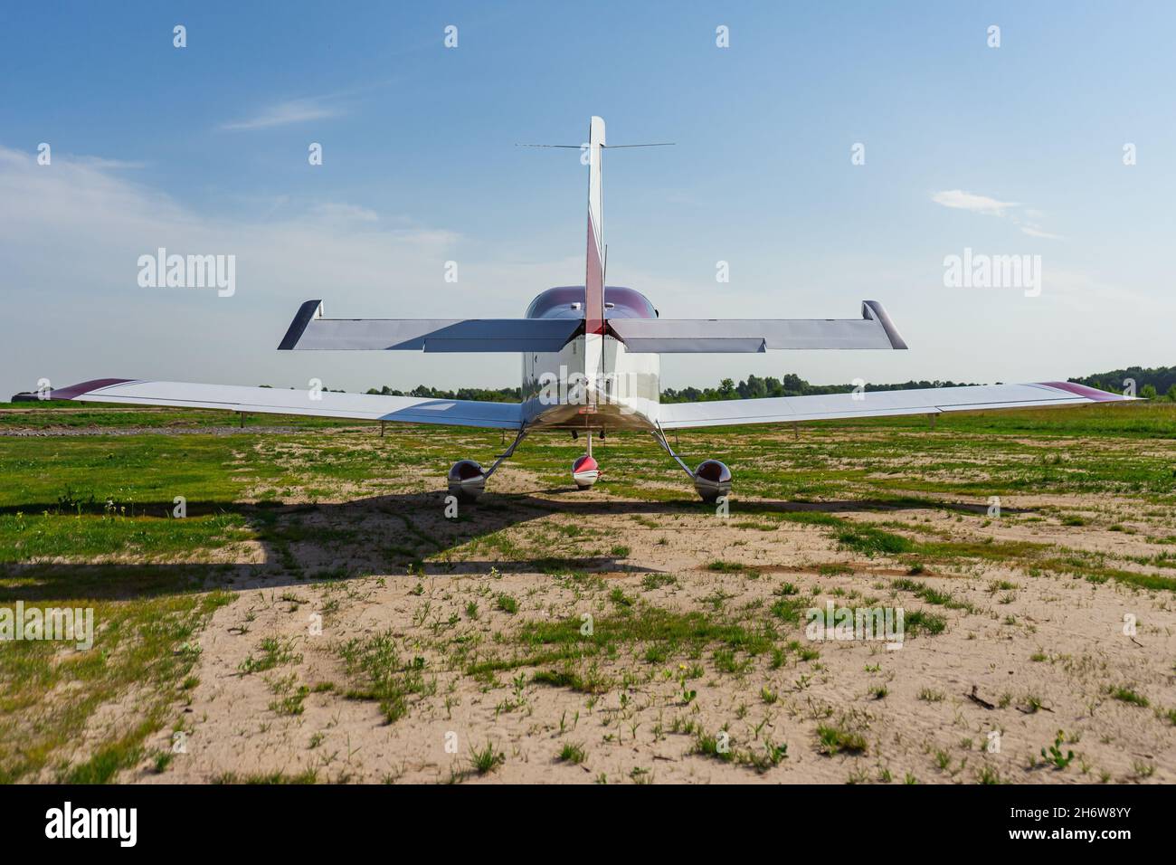 Small modern private jet before the flight against the backdrop of ...