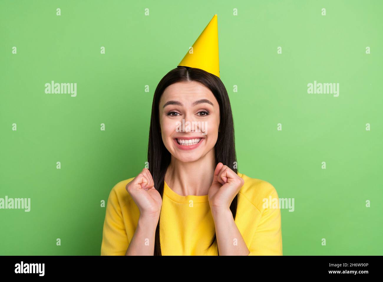 Photo portrait of woman wearing birthday cone gesturing like winner ...