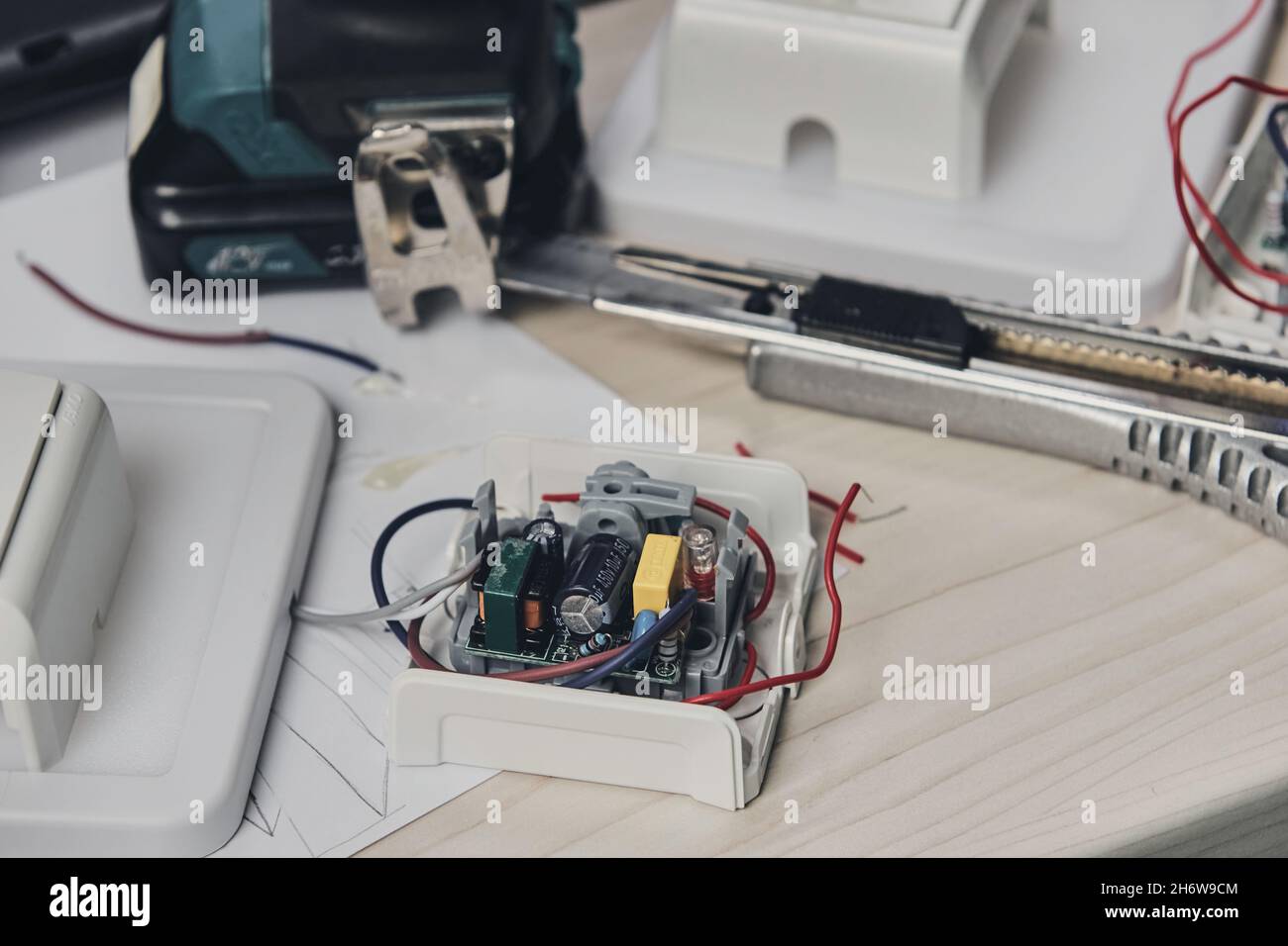 Repair of electronic devices, tin soldering parts. Hands of man holding ...