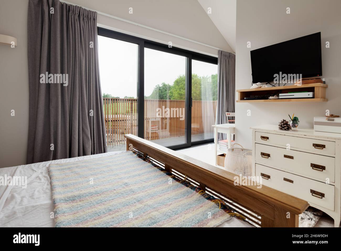 Dry Drayton, England - August 2 2019: Bedroom with large sliding patio ...