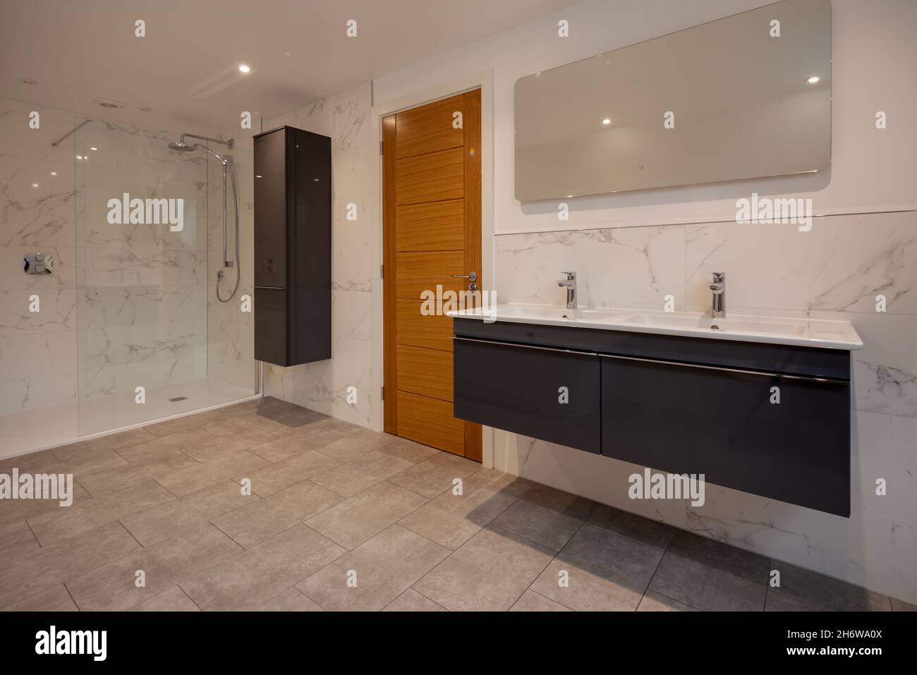 Clavering, England - April 6 2020: Well lit shower room within recently ...