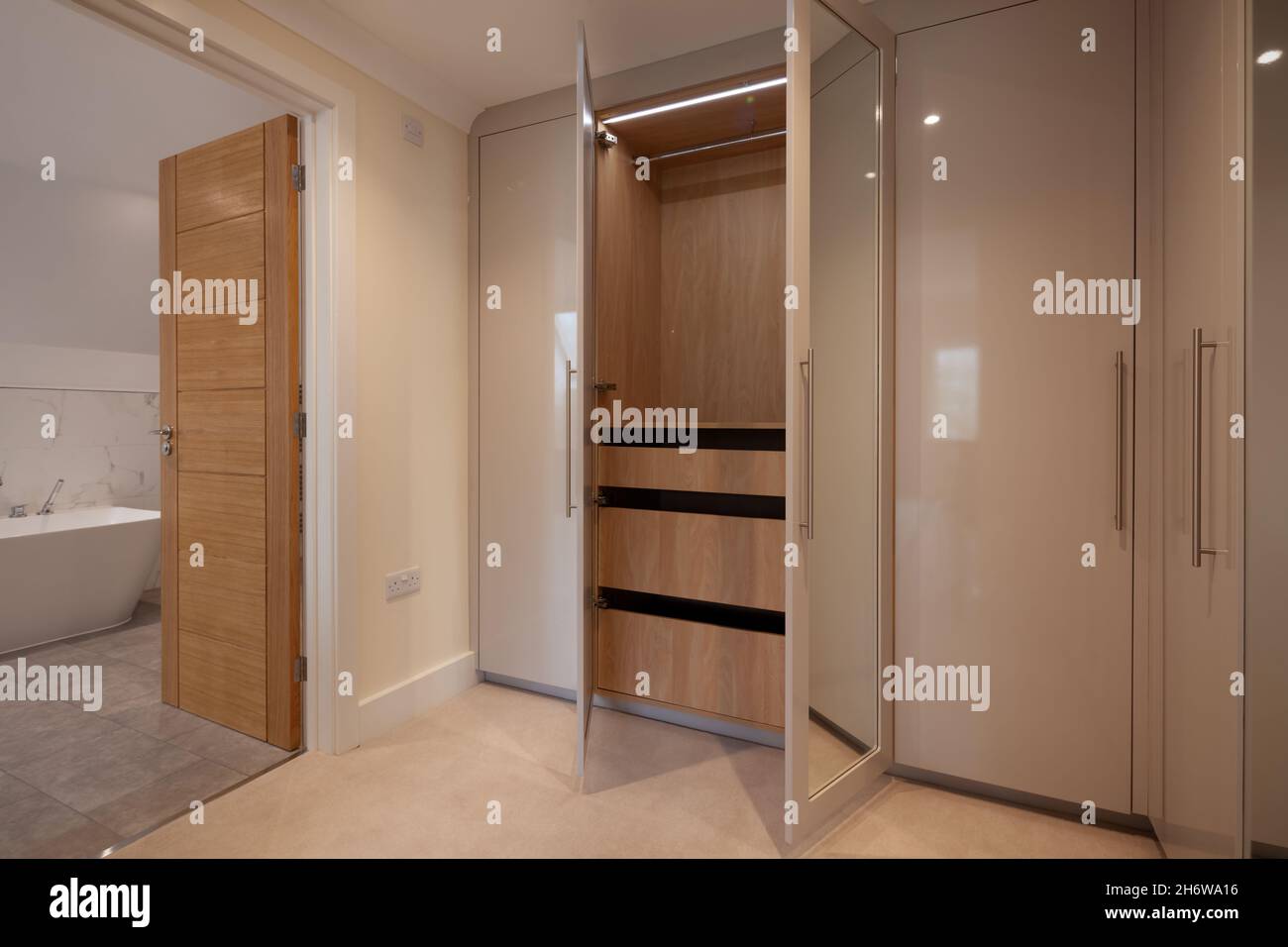 Clavering, England - April 6 2020: Dressing room with open wardrobe ...