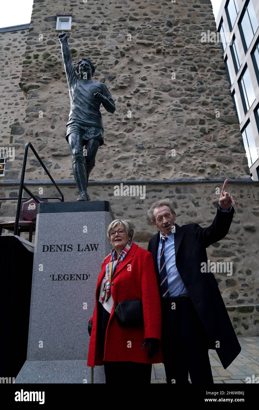 Denis Law poses alongside his wife Diana Law with his statue in ...