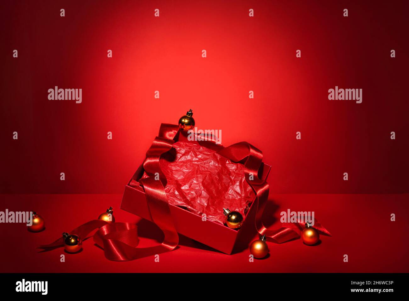 Blank open red holiday gift box with ribbon and Christmas decor. Layout ...