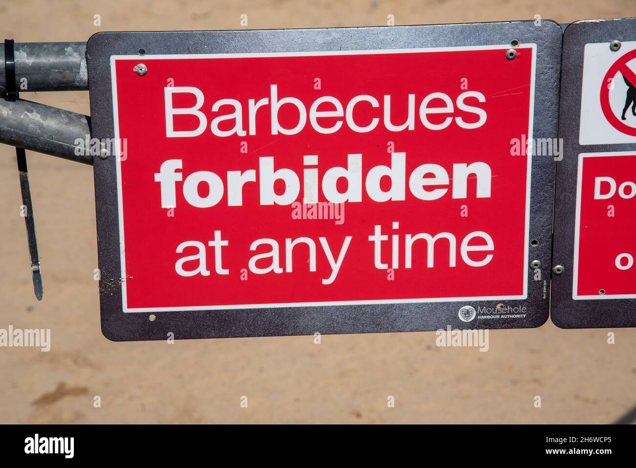Cornwall, England, UK. 2021. Barbecues forbidden red and white sign at ...