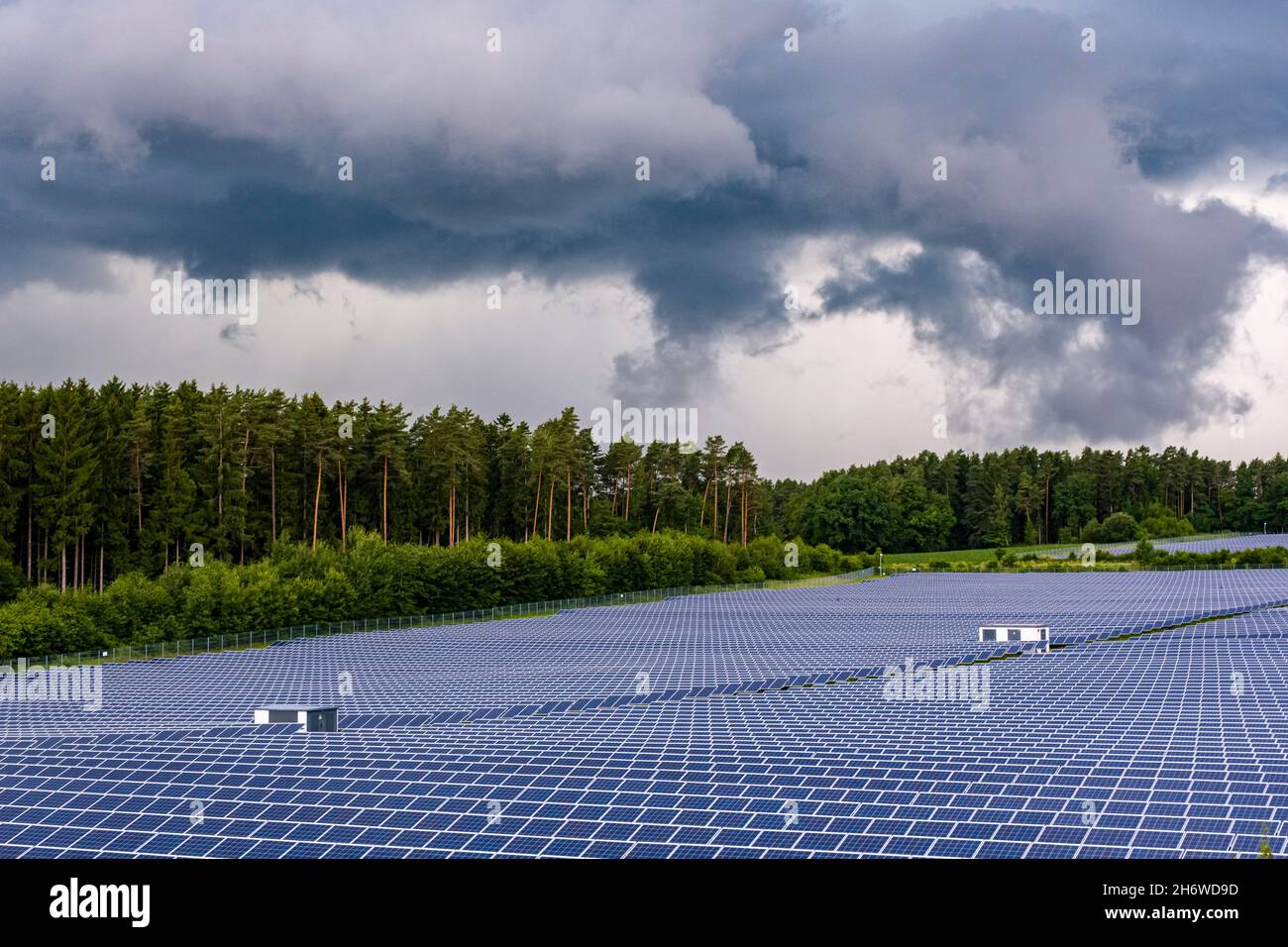 Dark thunderstorm and rain clouds over a big solar powerplant Stock ...