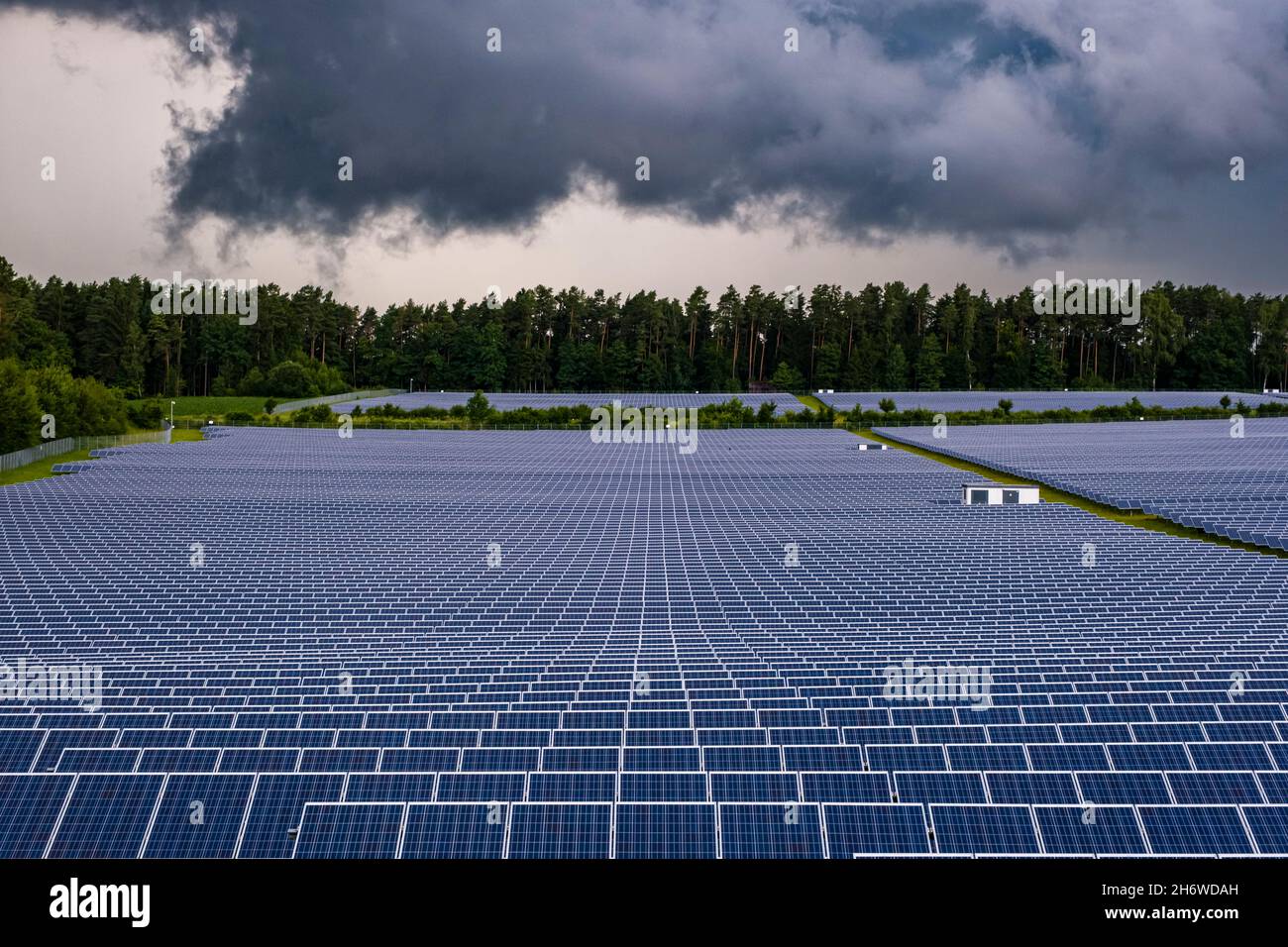 Dark thunderstorm and rain clouds over a big solar powerplant Stock ...