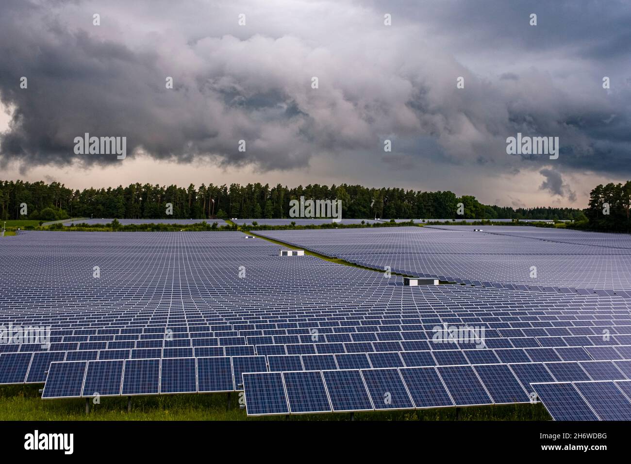 Dark thunderstorm and rain clouds over a big solar powerplant Stock ...