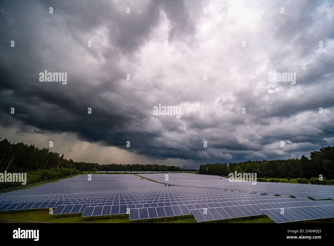 Dark thunderstorm and rain clouds over a big solar powerplant Stock ...