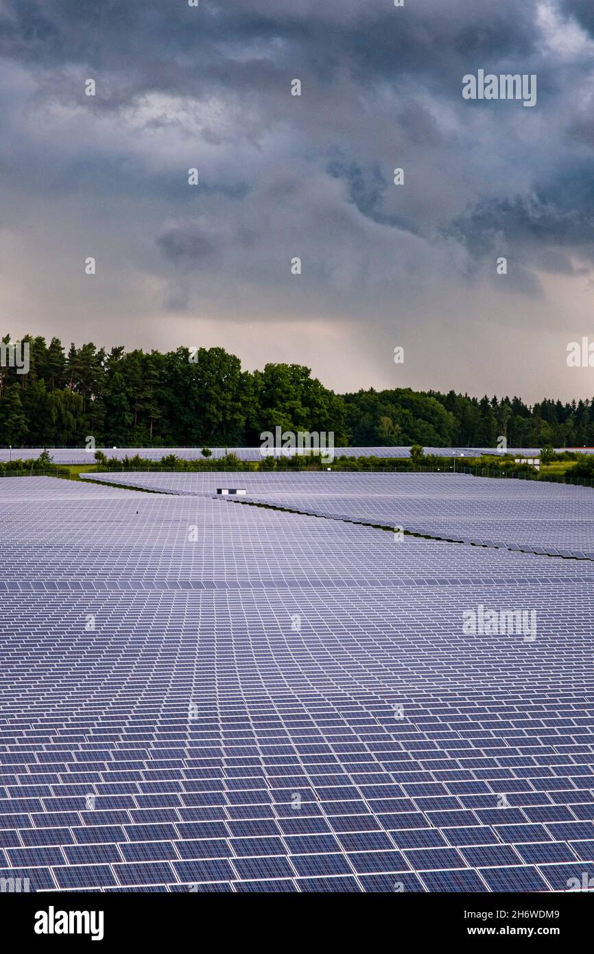 Dark thunderstorm and rain clouds over a big solar powerplant Stock ...