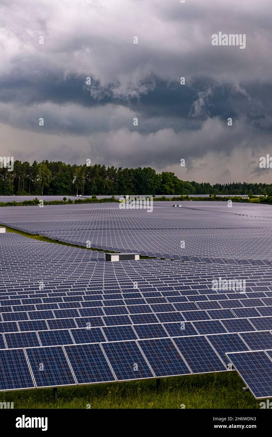 Dark thunderstorm and rain clouds over a big solar powerplant Stock ...