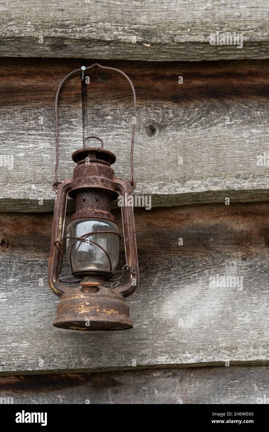 wooden shed with old rusted lamp Stock Photo - Alamy
