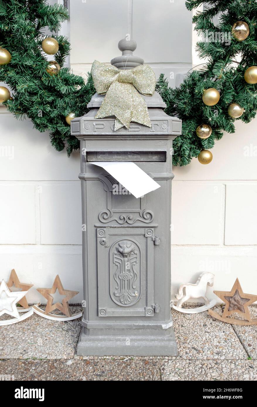 A letter in old-fashioned mailbox near house on the eve New Year ...