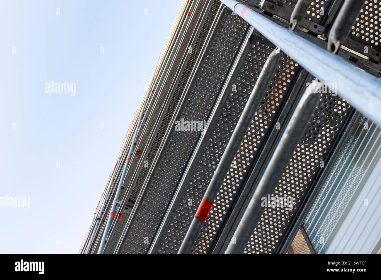 Scaffold mounted on a glass building at the construction site Stock ...