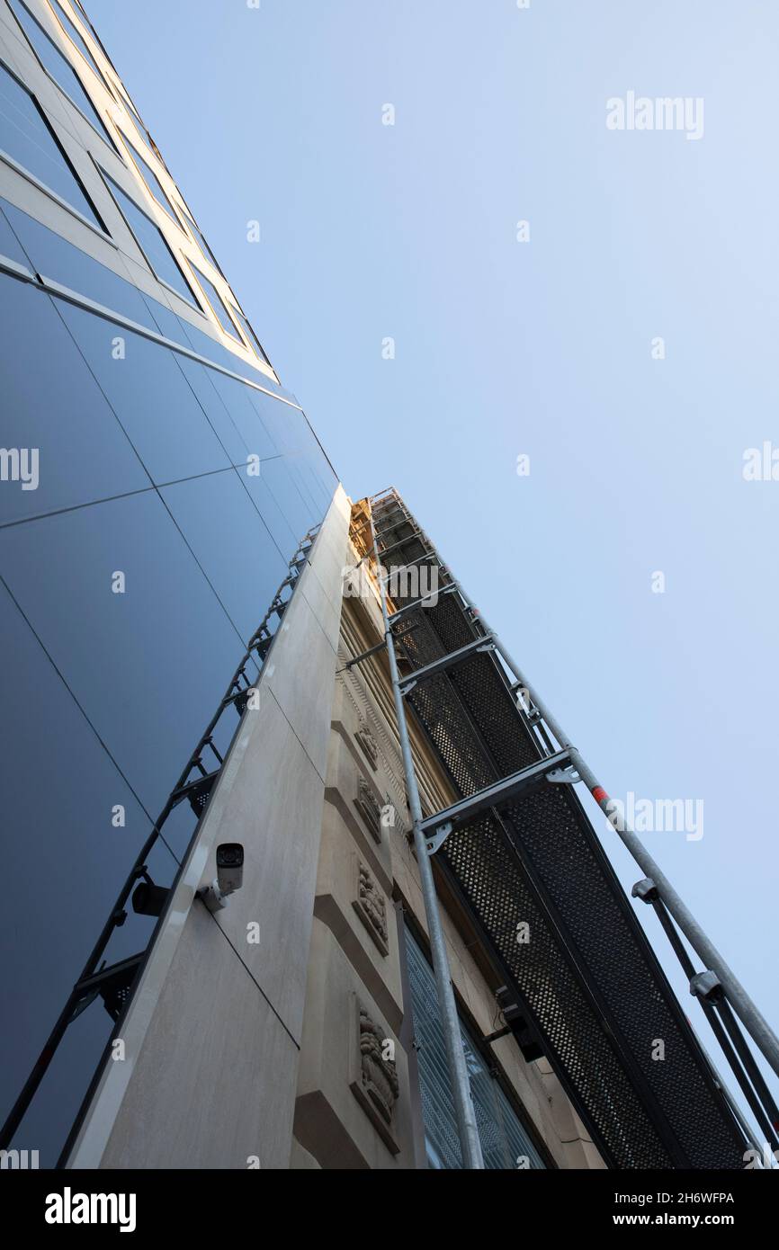 Scaffold mounted on a glass building at the construction site Stock ...
