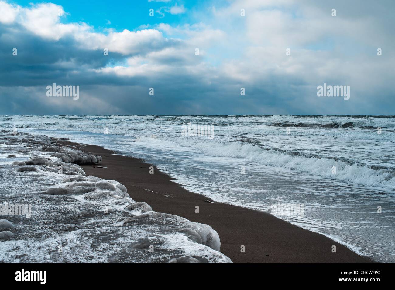 Winter landscape with frozen sea and icy beach. Dramatic seascape ...
