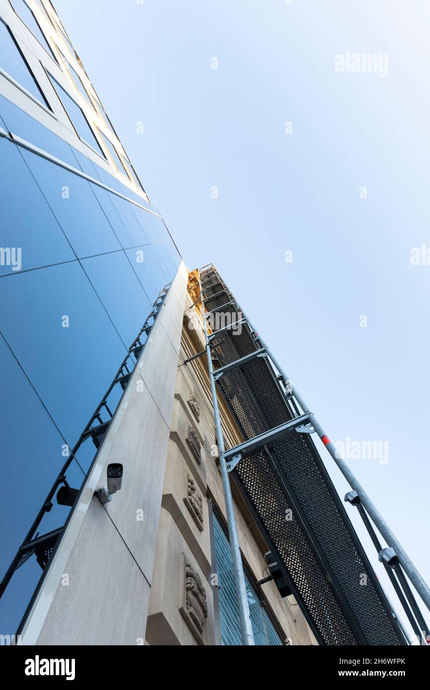Scaffold mounted on a glass building at the construction site Stock ...