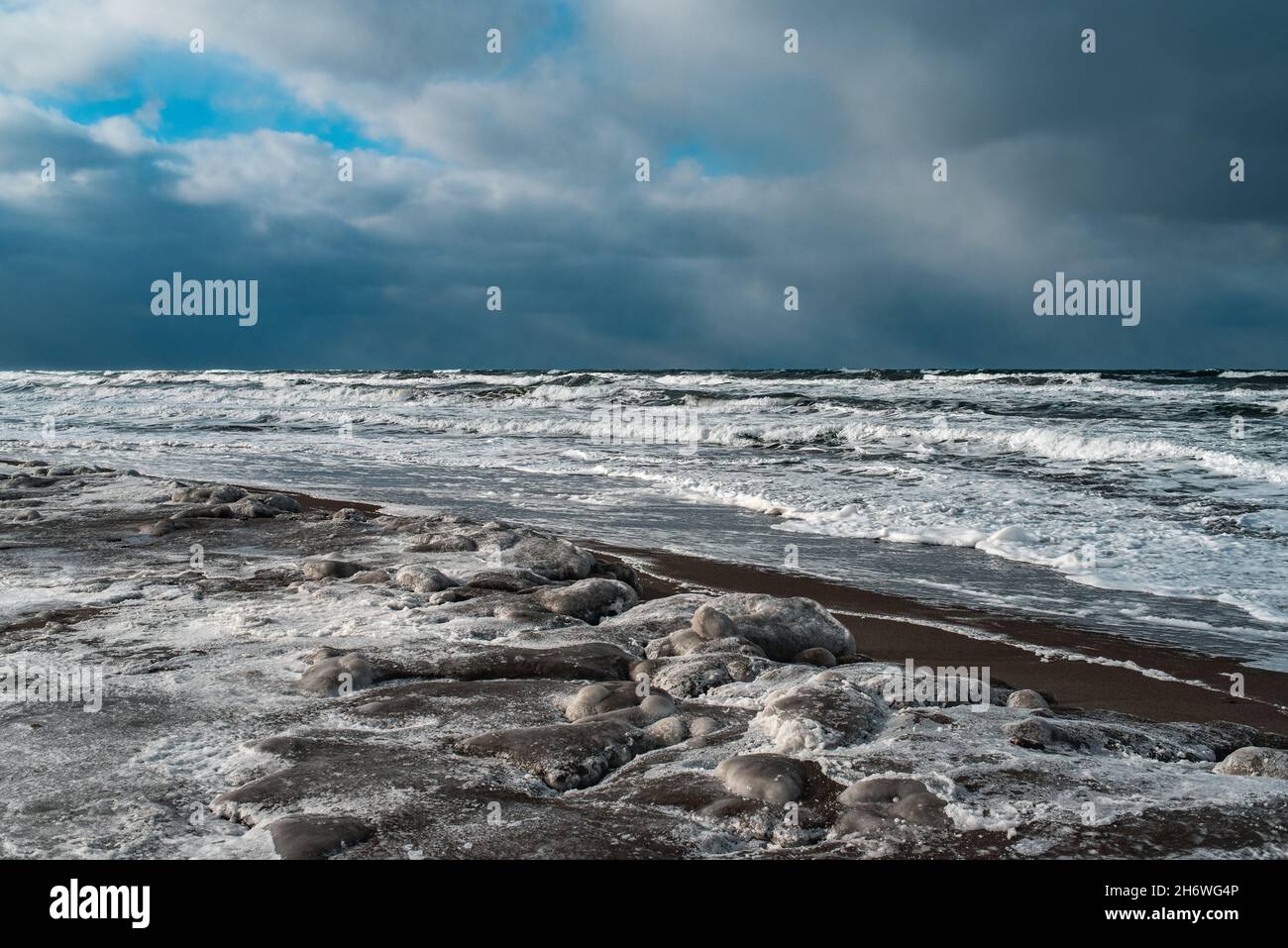 Winter landscape with frozen sea and icy beach. Dramatic seascape ...