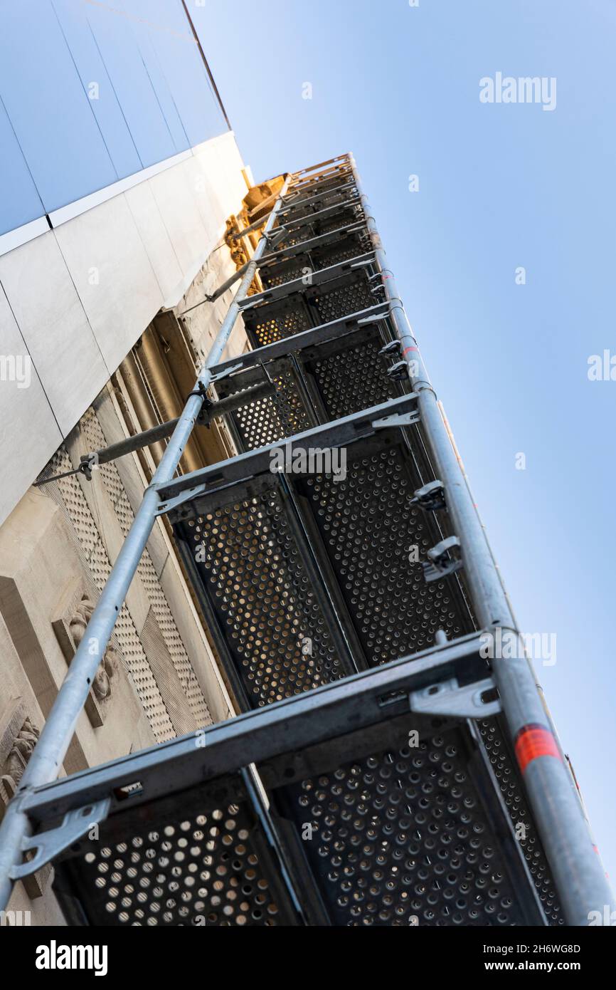 Scaffold mounted on a glass building at the construction site Stock ...