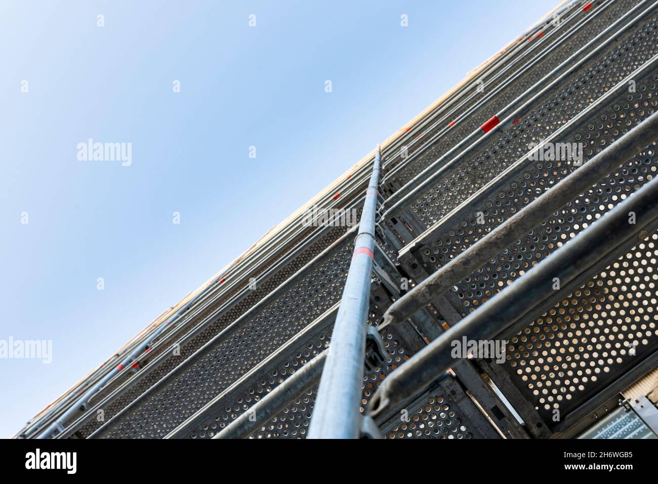 Scaffold mounted on a glass building at the construction site Stock ...