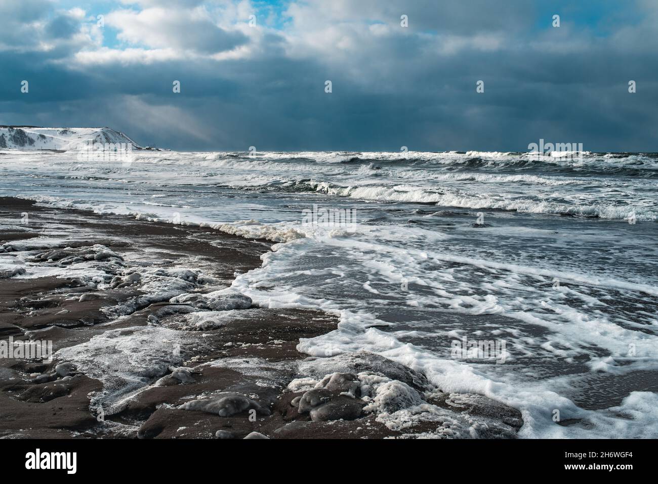 Winter landscape with frozen sea and icy beach. Dramatic seascape ...