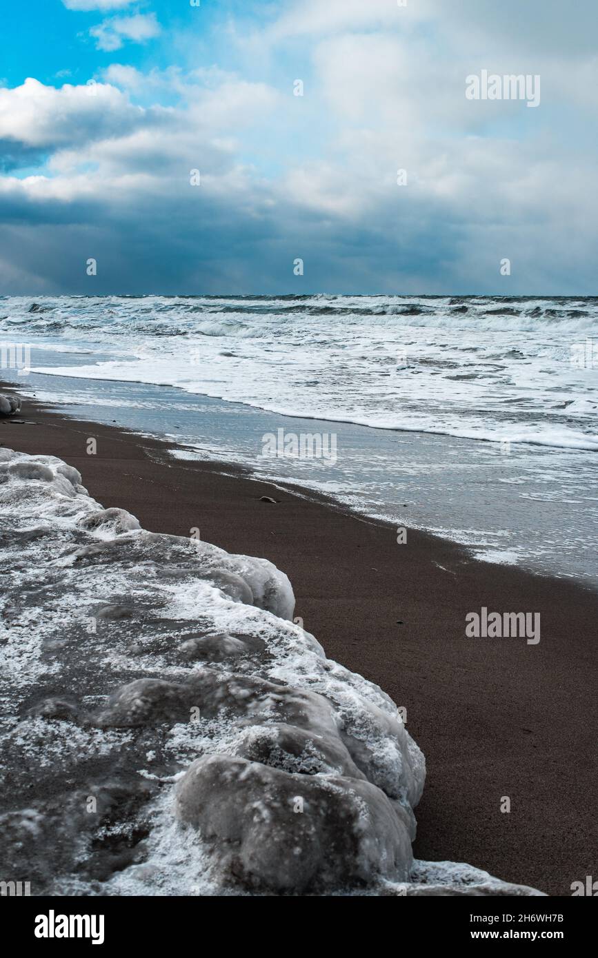 Winter landscape with frozen sea and icy beach. Dramatic seascape ...