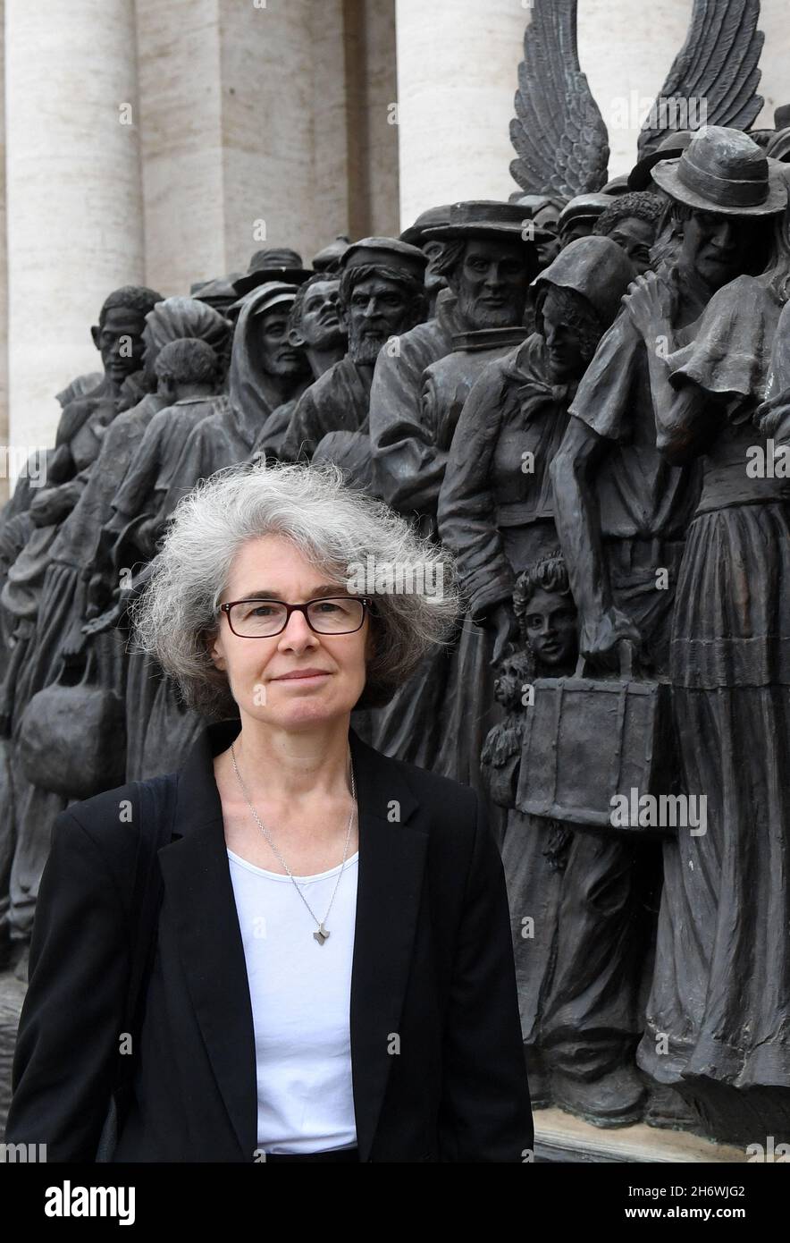 Nathalie Becquart at Saint Peters square near the sculpture to migrants ...