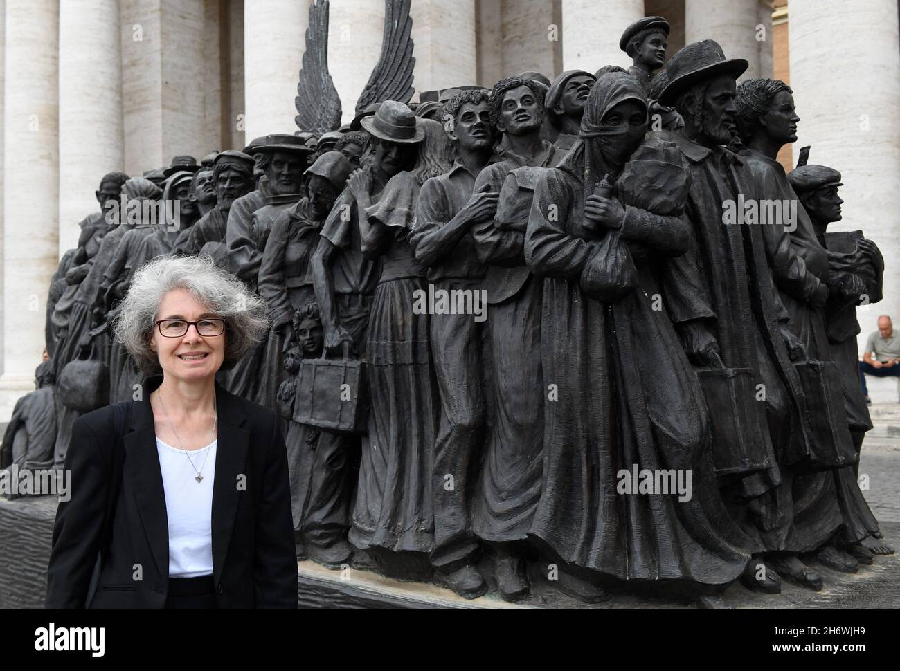 Nathalie Becquart at Saint Peters square near the sculpture to migrants ...