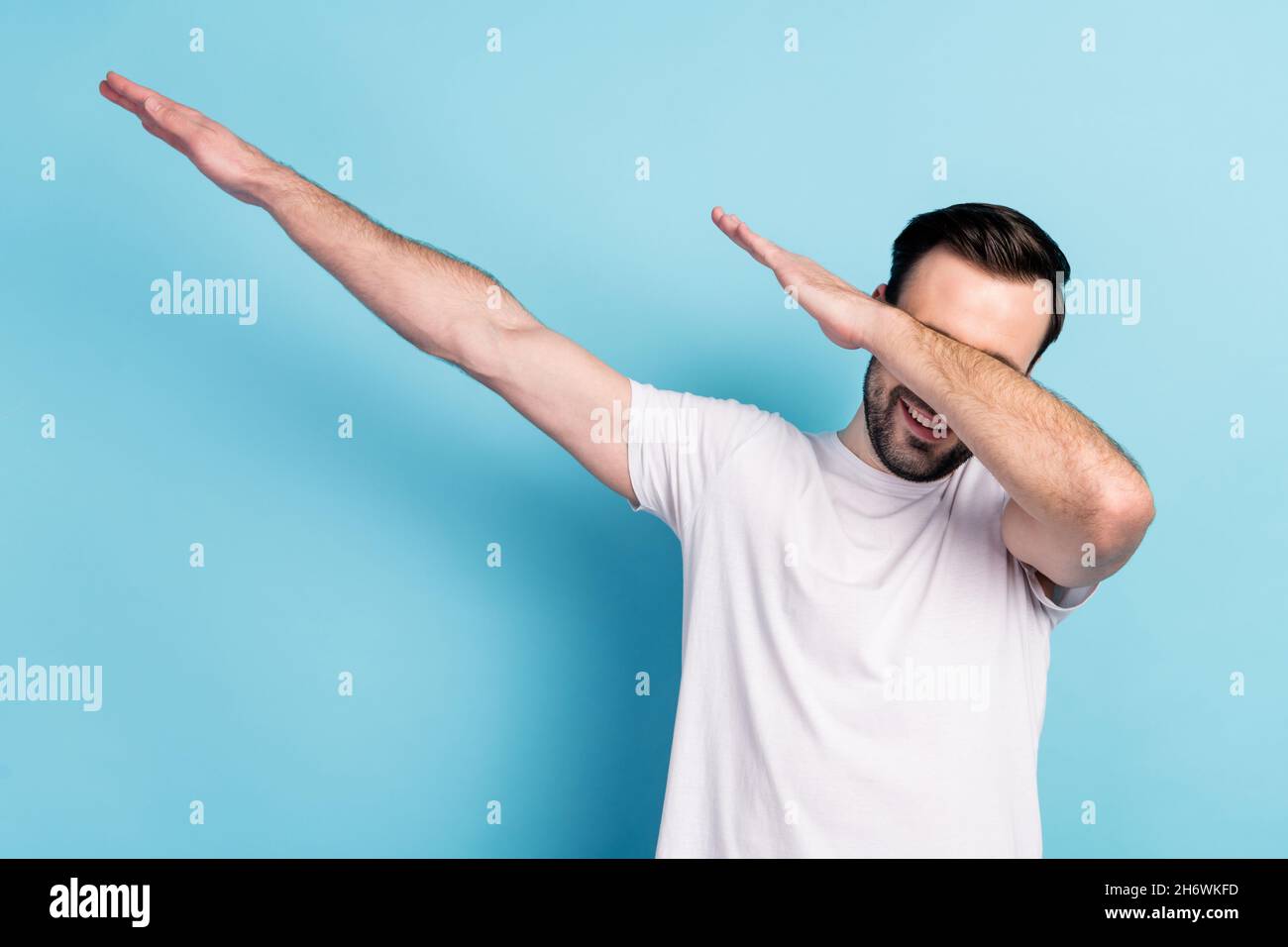 Portrait of attractive cheerful funky guy dancing having fun dab ...