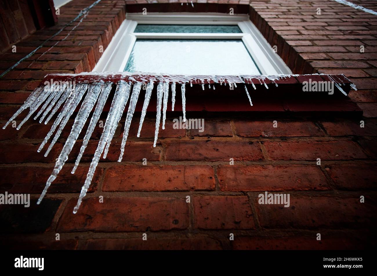Icicles hanging from the window of a Victorian terraced house in ...
