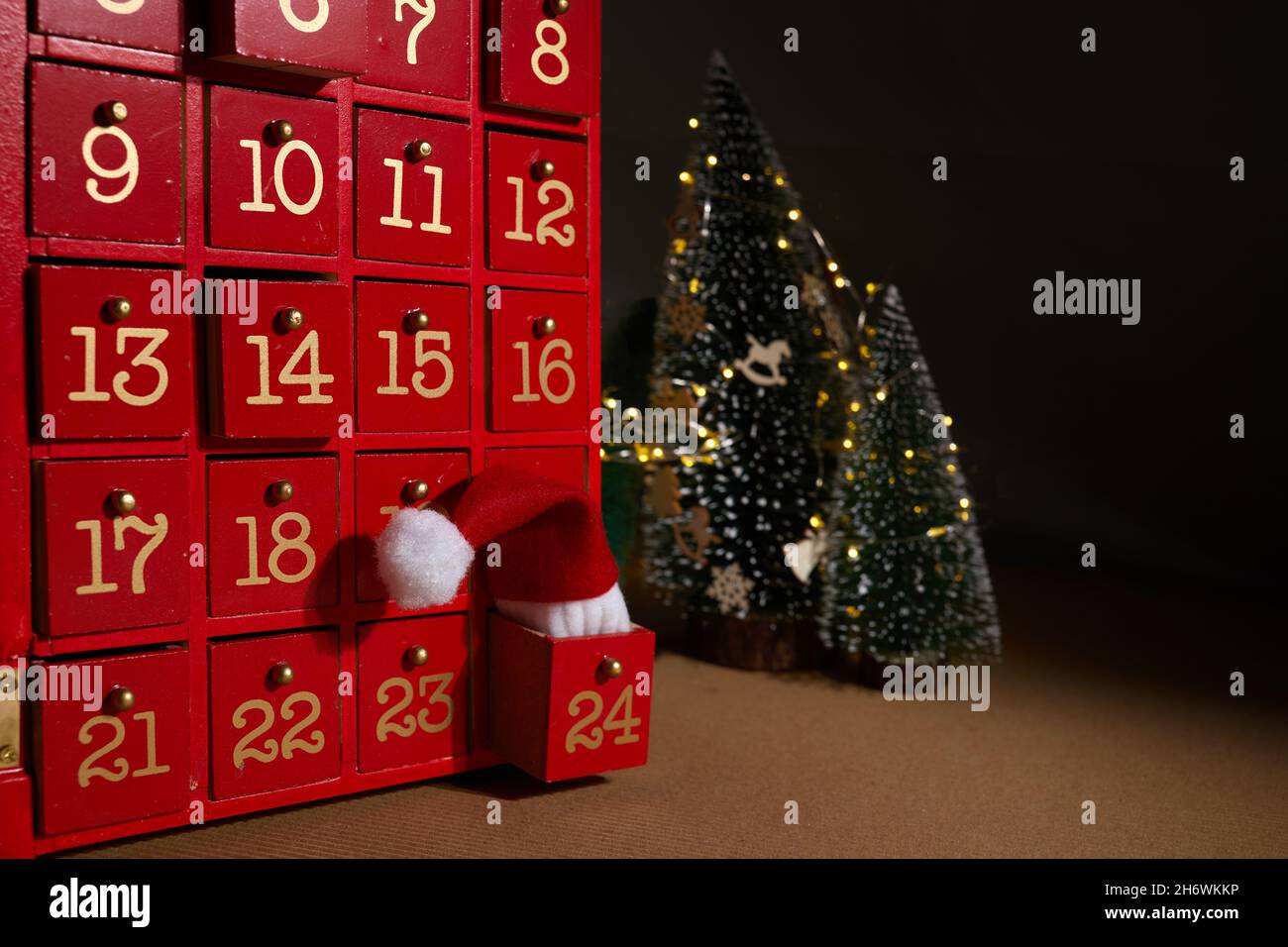 Red Christmas Advent Calendar with Santa Claus hat Stock Photo - Alamy