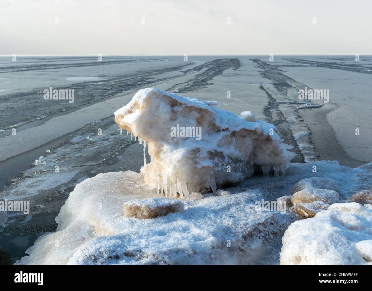 winter landscape by the sea, snowy pieces of ice by the sea and ice ...