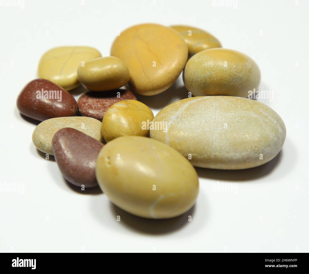 colorful sea stone collection on white floor Stock Photo - Alamy