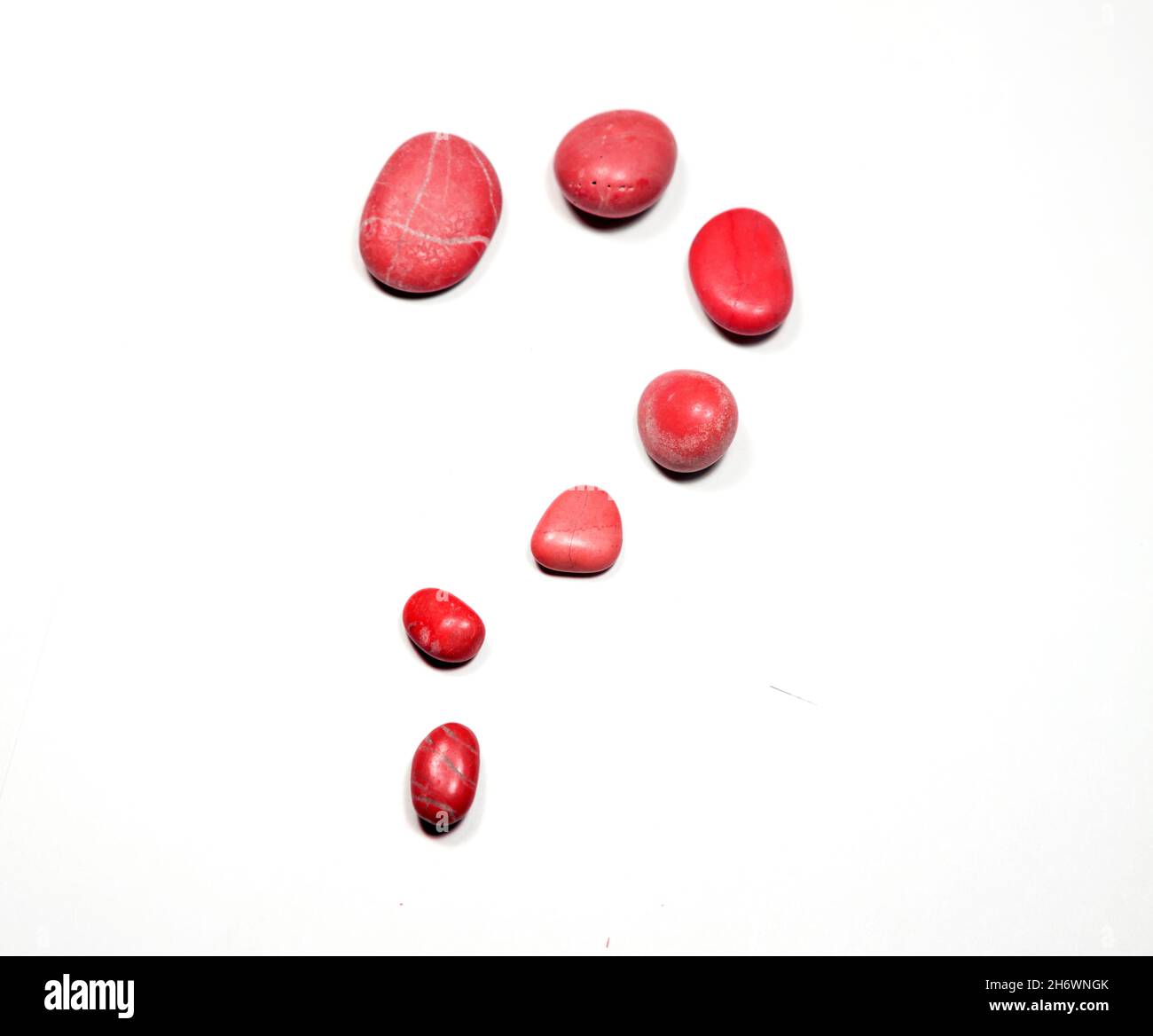 question mark with small red stones on white floor Stock Photo - Alamy