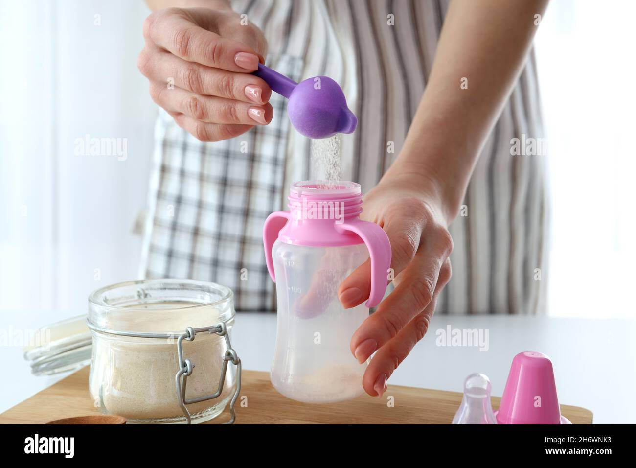 Concept of baby food with рowdered milk on tulle background Stock Photo ...