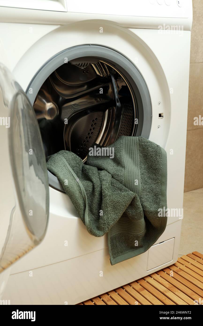 Concept of housework with washing machine in bathroom Stock Photo - Alamy