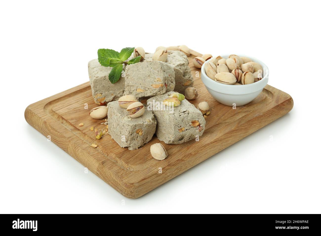 Concept of tasty food with halva isolated on white background Stock Photo - Alamy