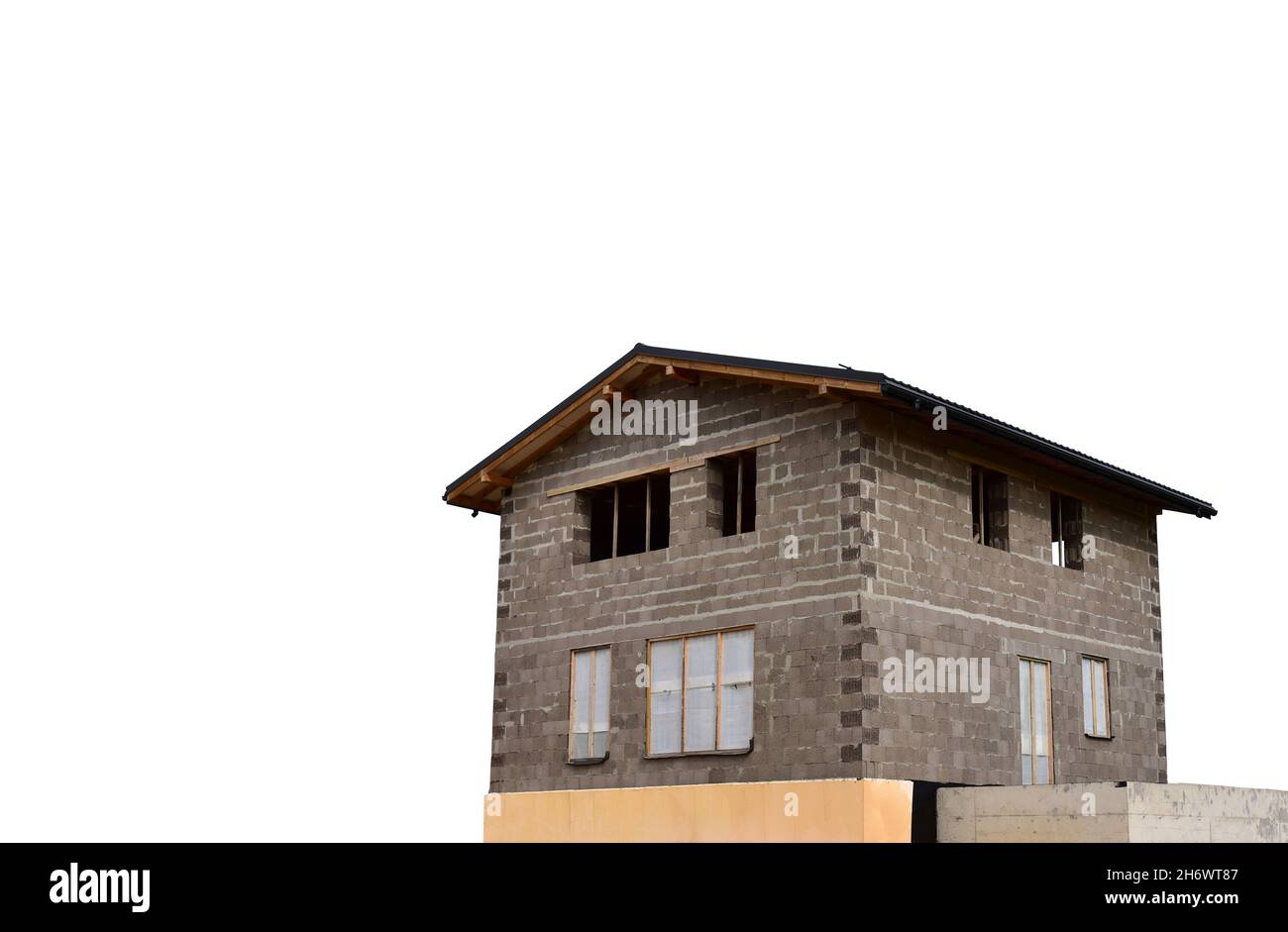 Unfinished private home of ceramsite concrete blocks isolated on white ...