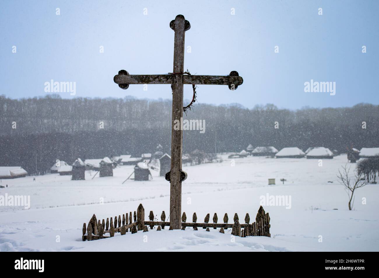 Wooden cross on winter background Stock Photo - Alamy