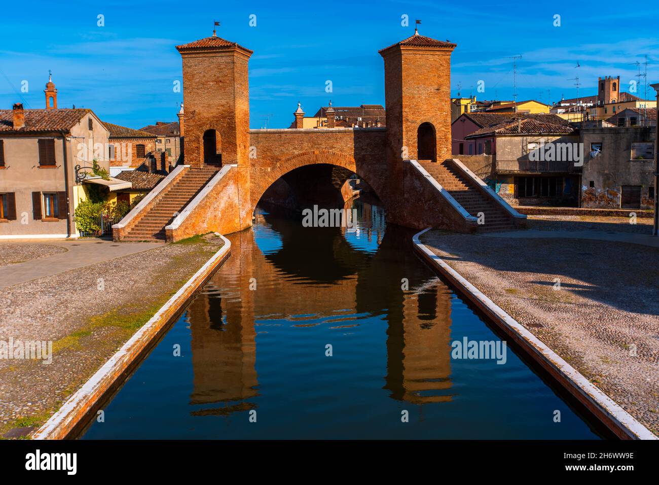 View of the picturesque town of Comacchio, with buildings and canals ...