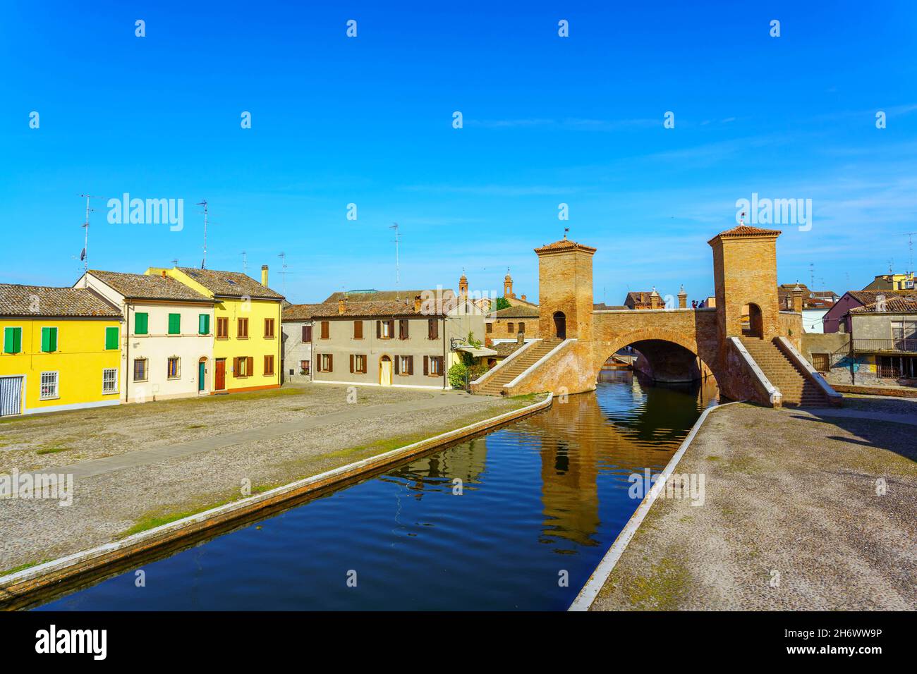 View of the picturesque town of Comacchio, with buildings and canals ...