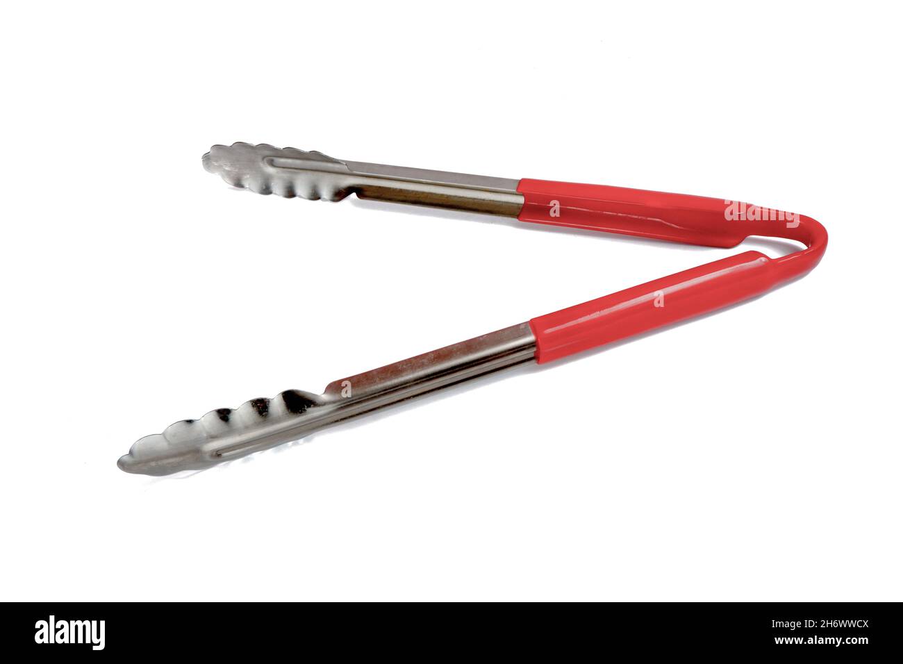 cooking tongs isolated on a white background Stock Photo - Alamy