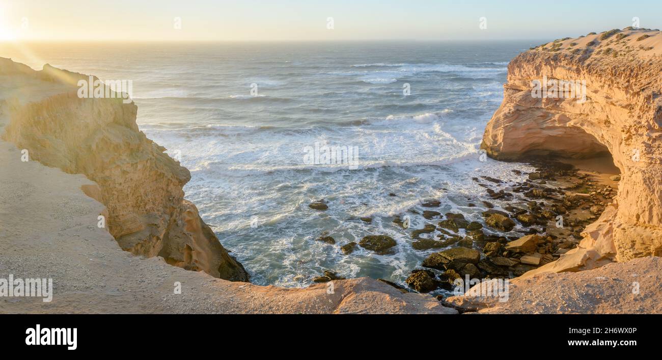 Moroccan Atlantic coast. Wind-sculpted sandy rock cliff Stock Photo - Alamy