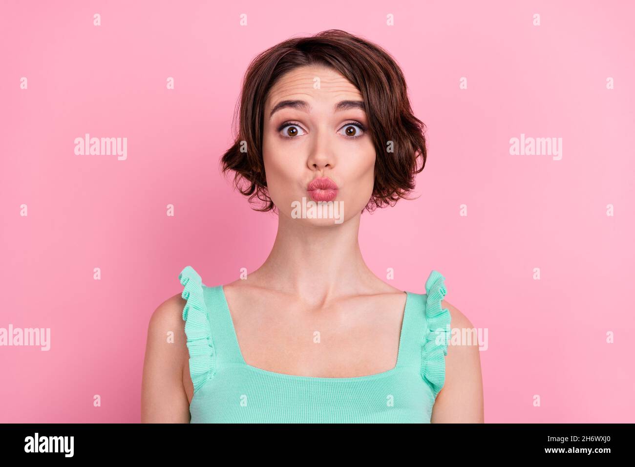 Portrait of attractive funny amorous girl sending air kiss isolated ...