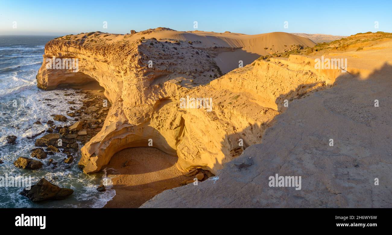 Moroccan Atlantic coast. Wind-sculpted sandy rock cliff Stock Photo - Alamy